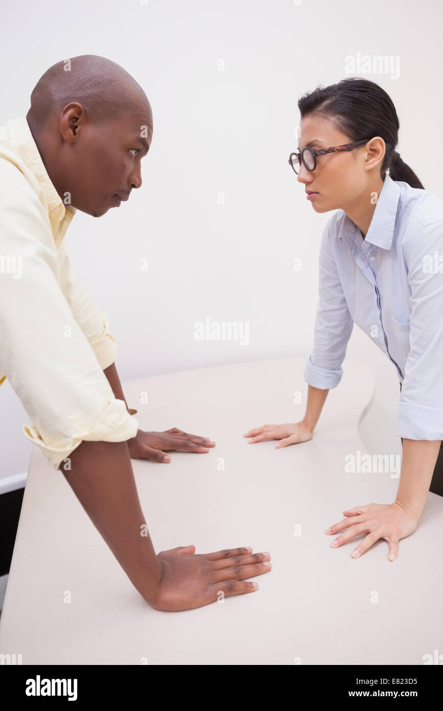 Casual business colleagues facing off Stock Photo - Alamy