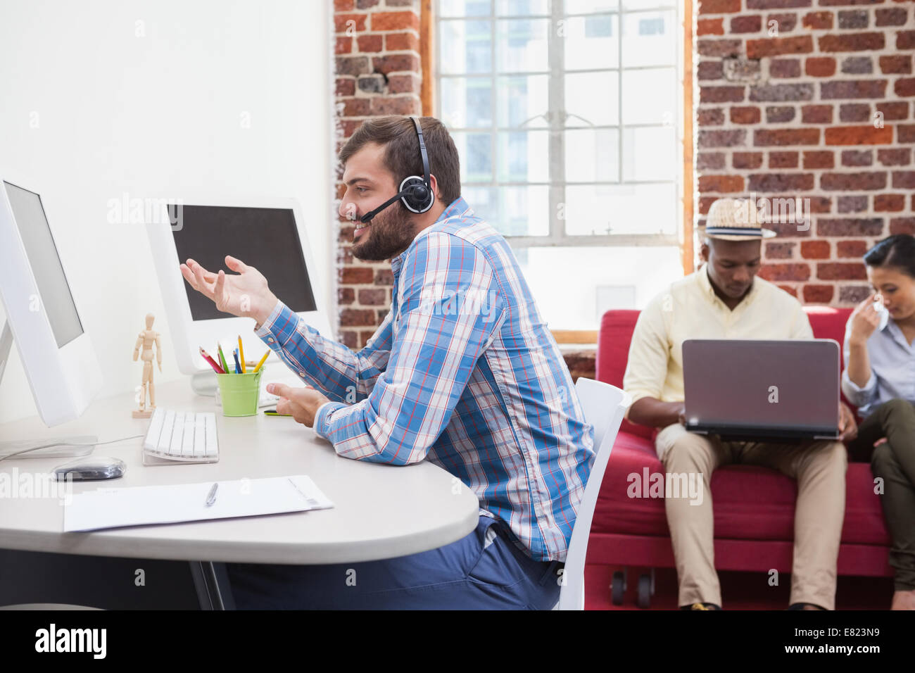 Casual businessman on video chat at his desk Stock Photo - Alamy