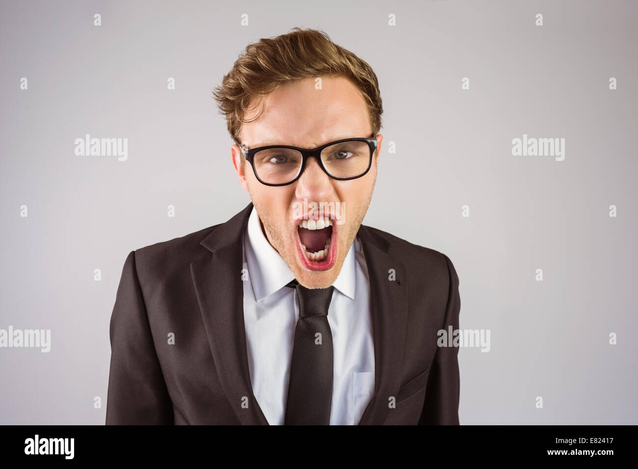 Young angry businessman shouting at camera Stock Photo - Alamy