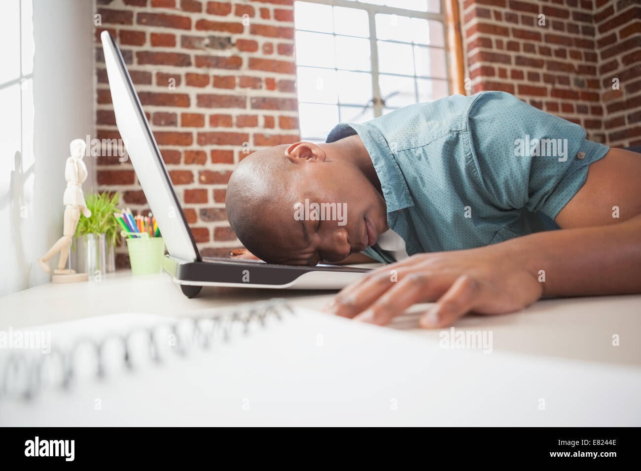 Black businessman sleeping desk hi-res stock photography and images - Alamy