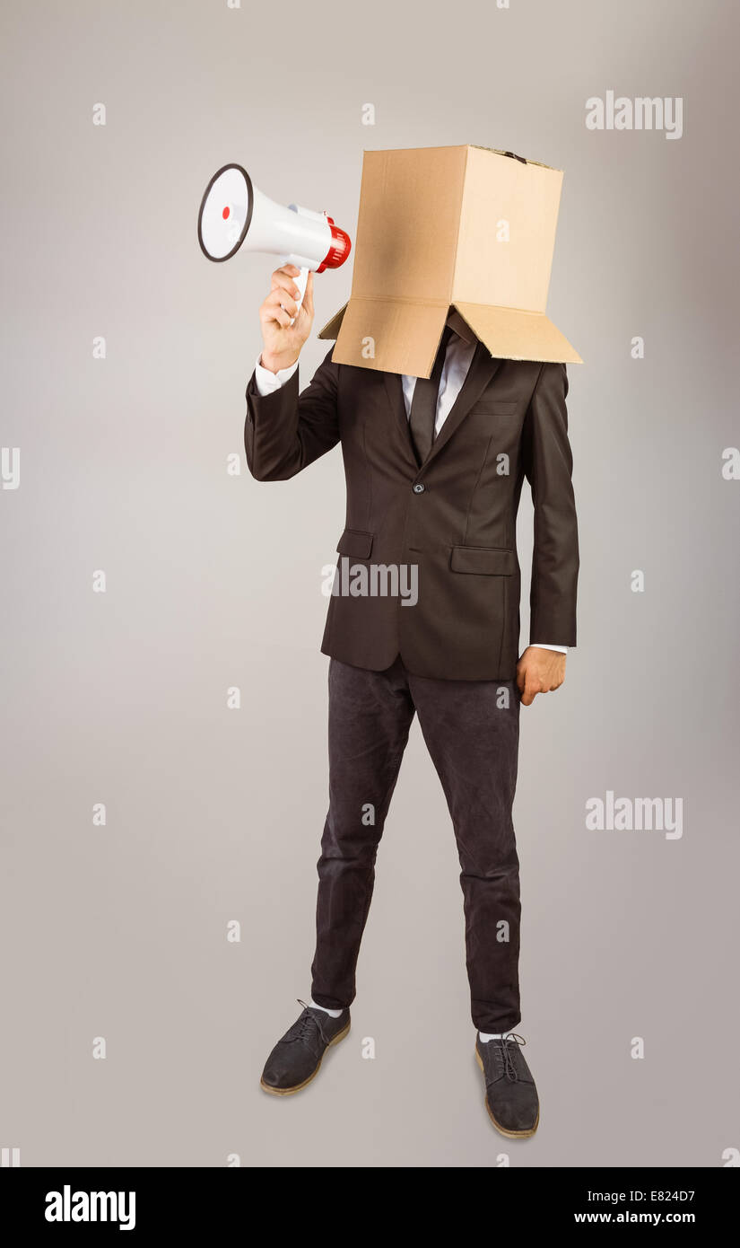 Anonymous businessman holding a megaphone Stock Photo - Alamy