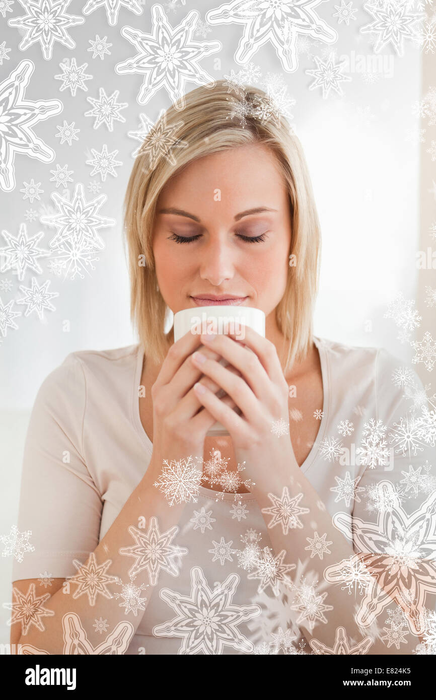 Woman smelling her cup of coffee Stock Photo - Alamy