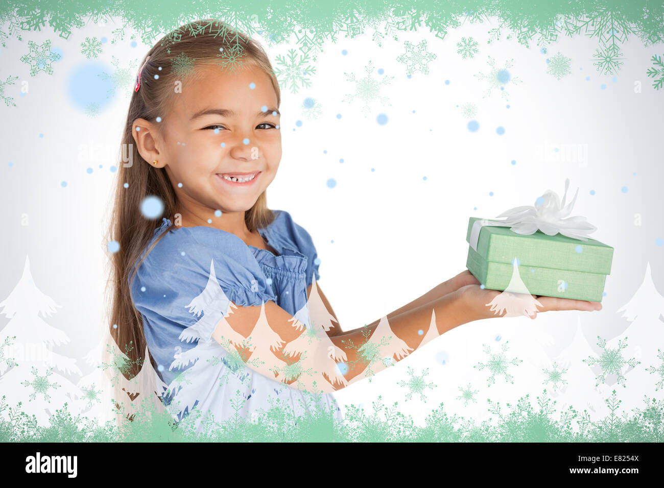 Cheerful little girl giving a present Stock Photo - Alamy