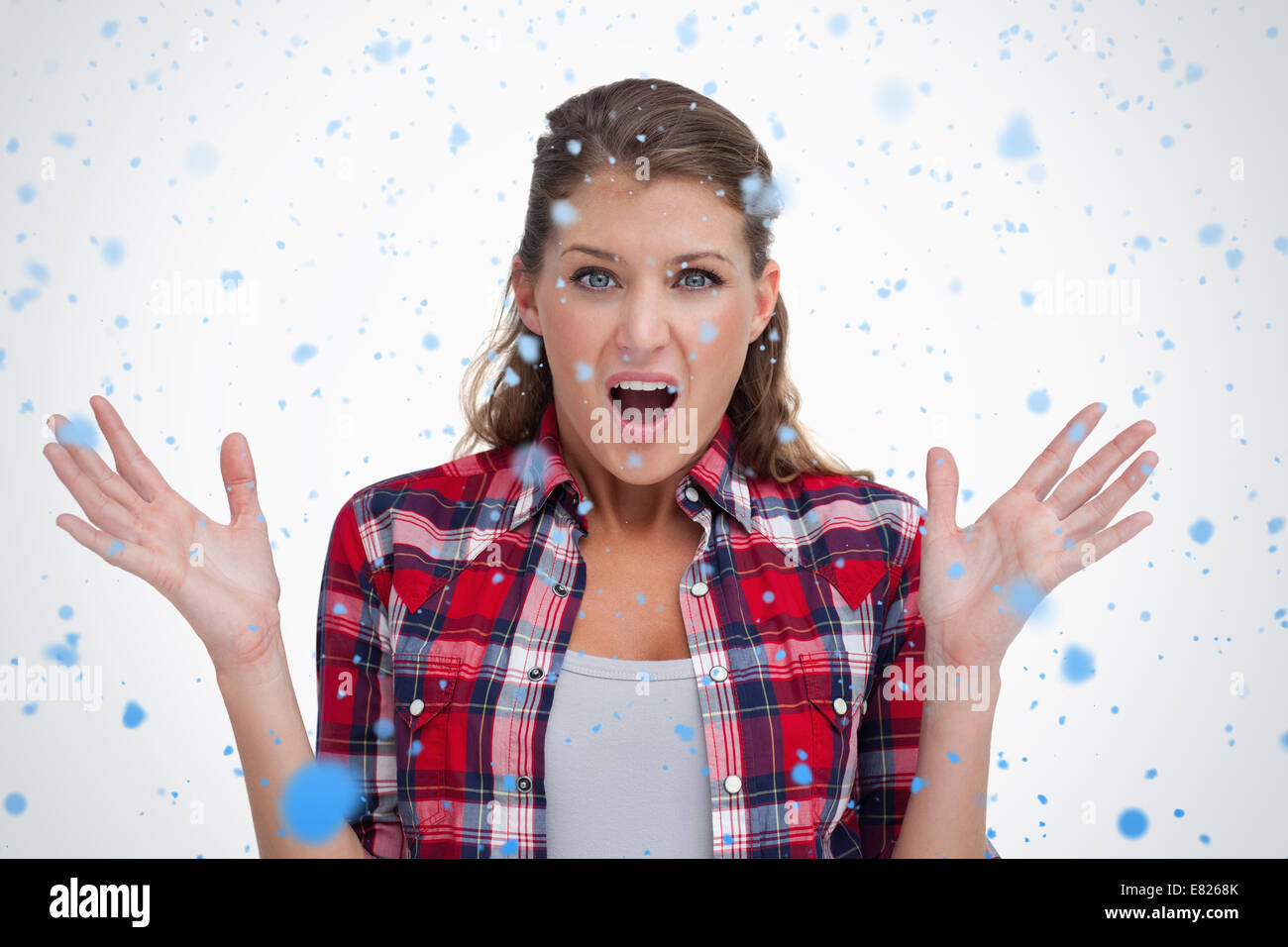 Composite image of shocked woman screaming Stock Photo - Alamy