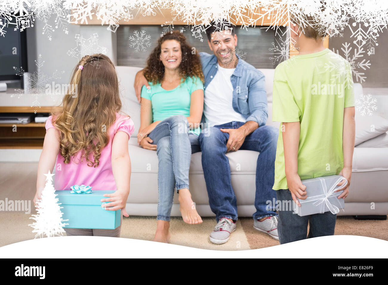 Happy siblings hiding presents behind their back from their parents ...