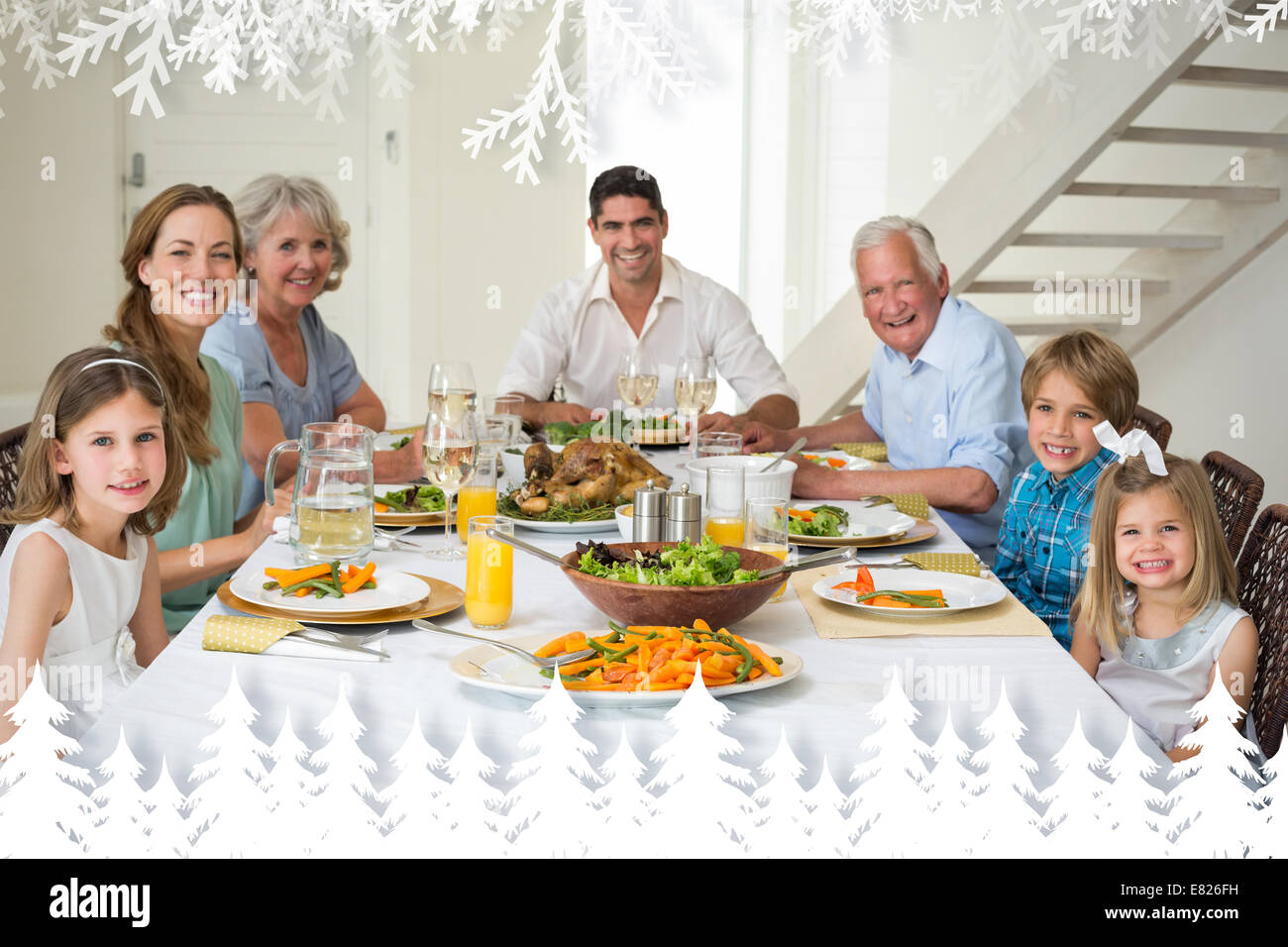 Composite image of family having meal together at dining table Stock ...