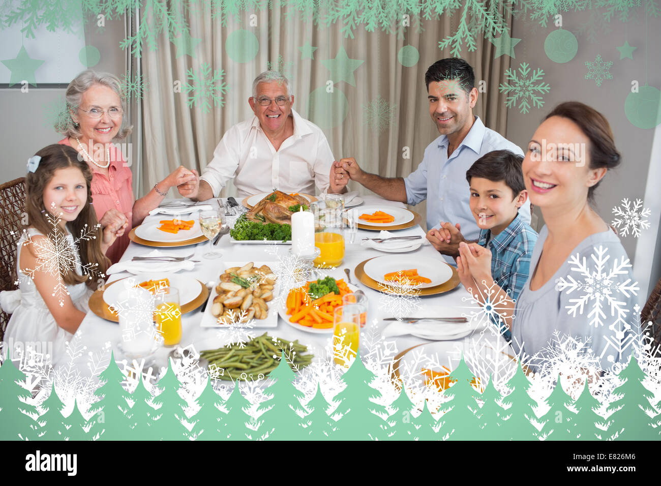 Composite image of portrait of an extended family at dining table Stock ...