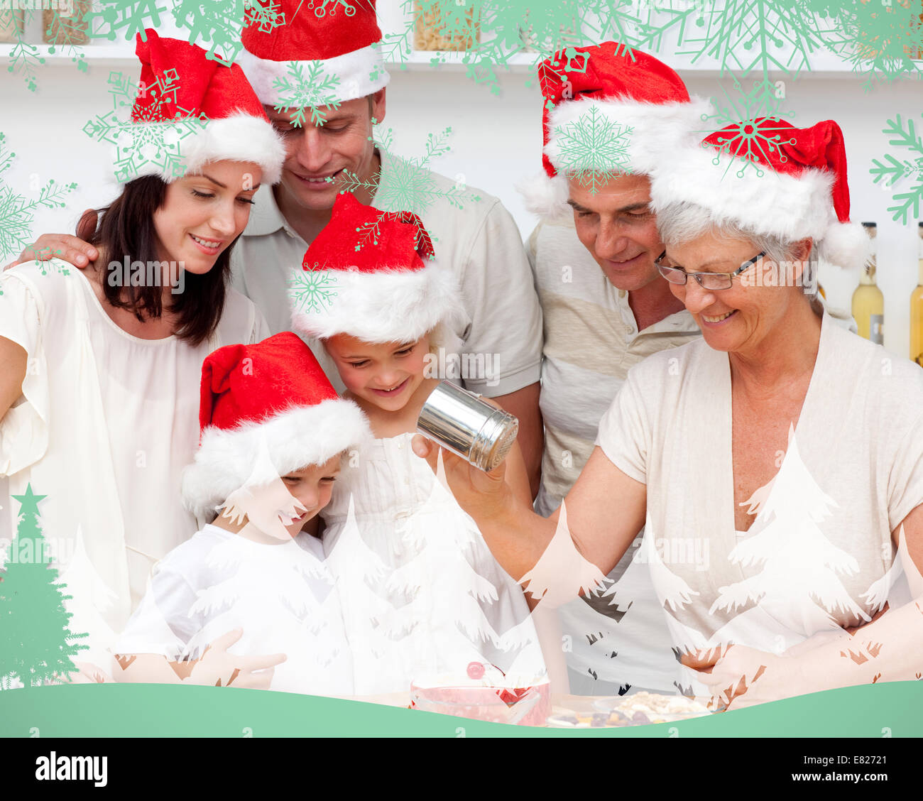 Composite image of happy family baking christmas cakes Stock Photo - Alamy