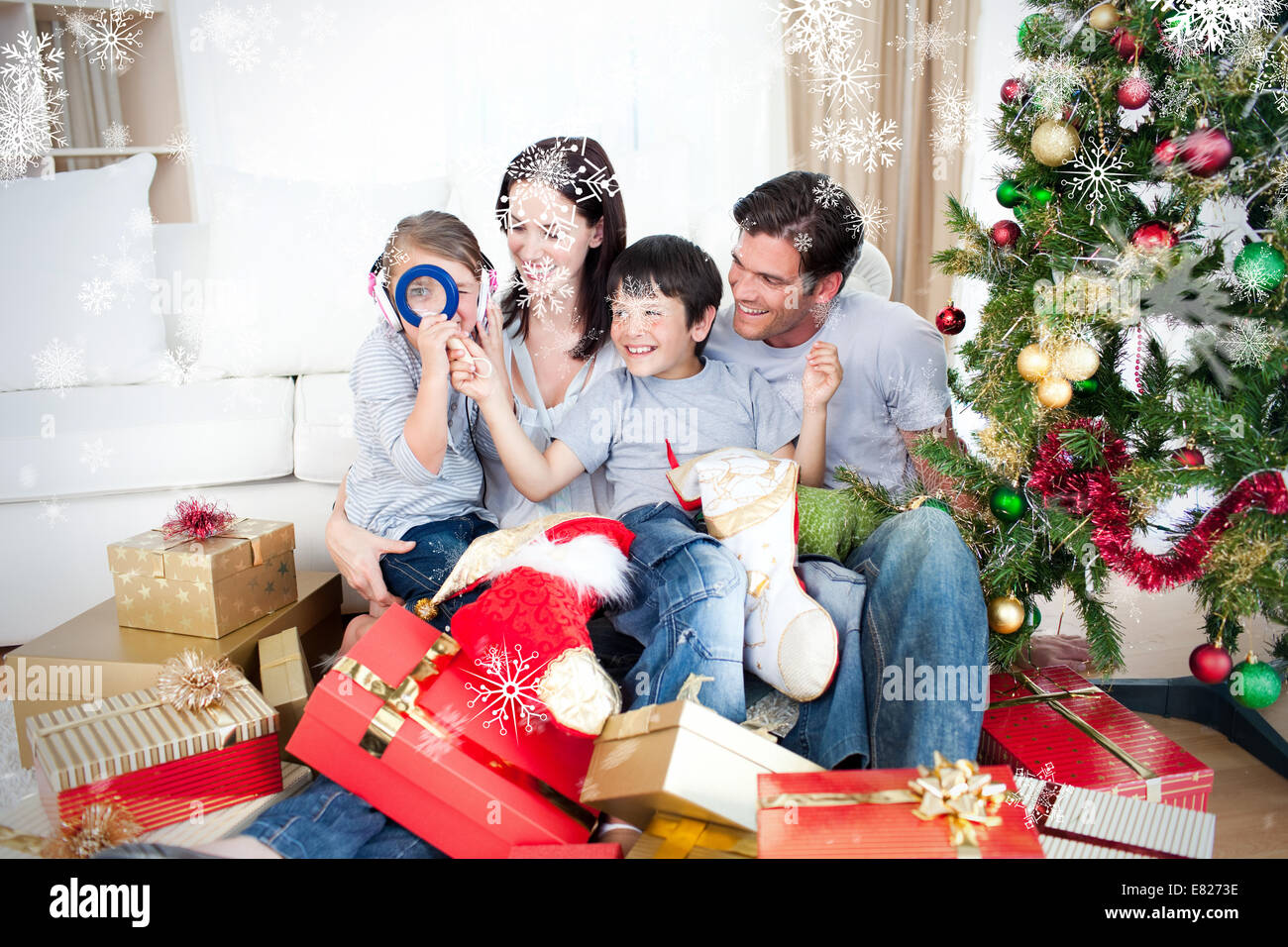 Happy family having fun with christmas presents Stock Photo - Alamy