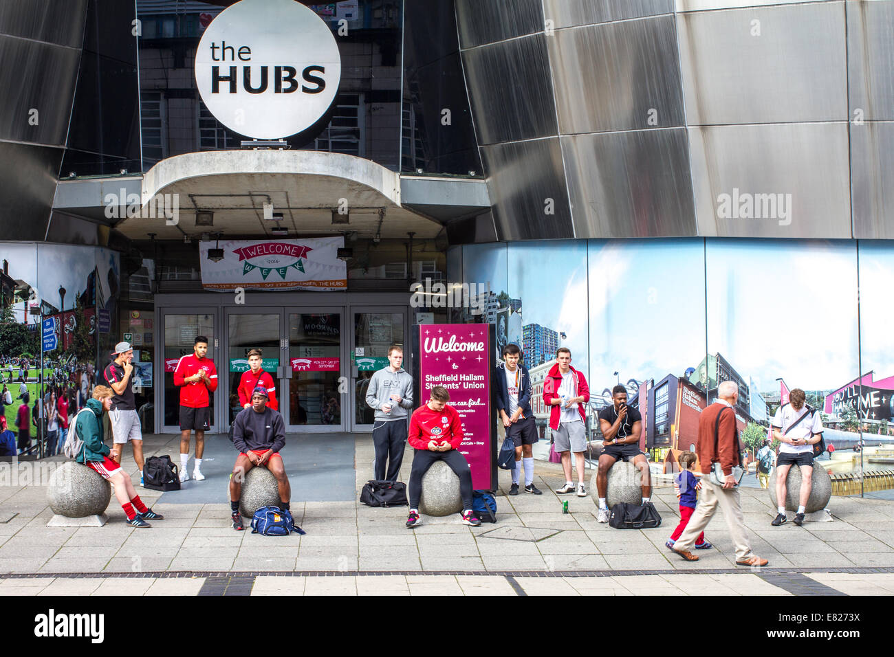 Students outside the Hubs student union building at Sheffield Hallam ...
