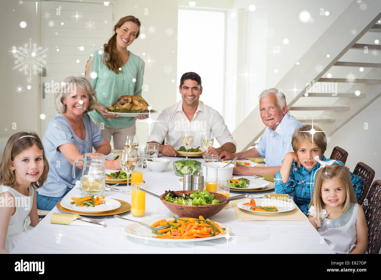 Composite image of family having meal at dining table Stock Photo - Alamy