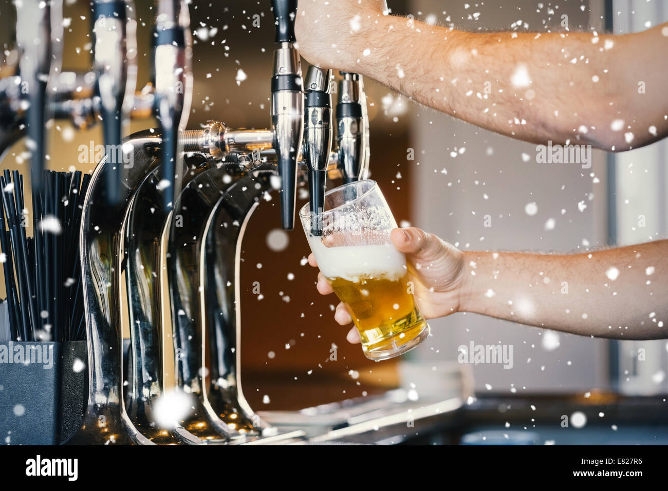 Composite image of barmans arms pulling a pint of beer Stock Photo - Alamy