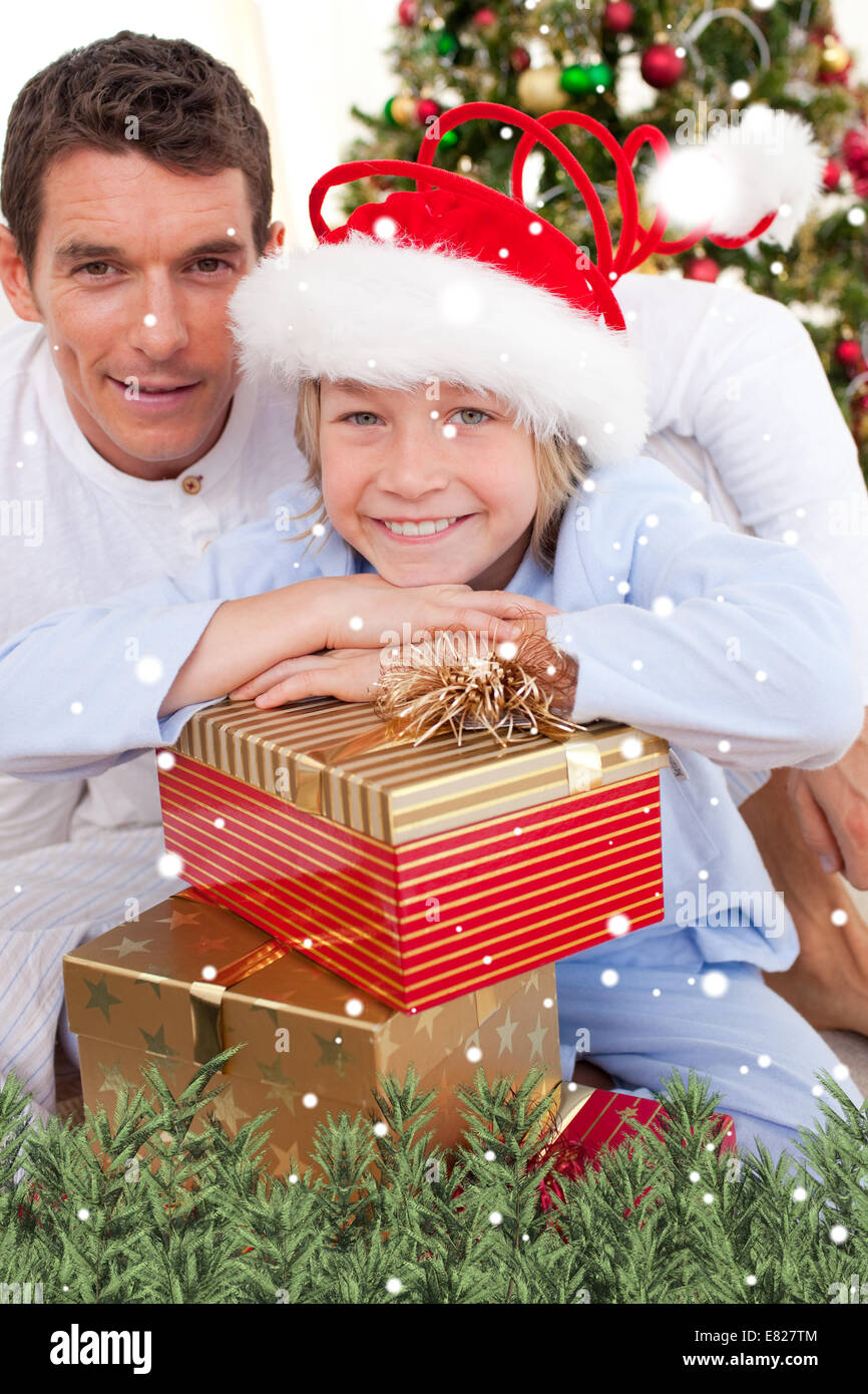 Portrait of a father and his son holding christmas presents Stock Photo ...