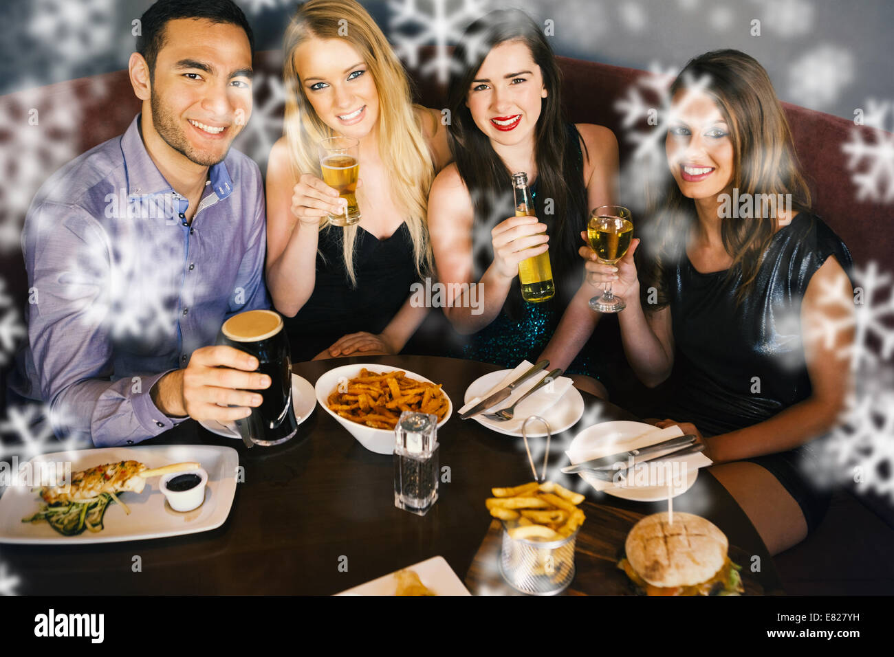 Happy friends having dinner together Stock Photo - Alamy