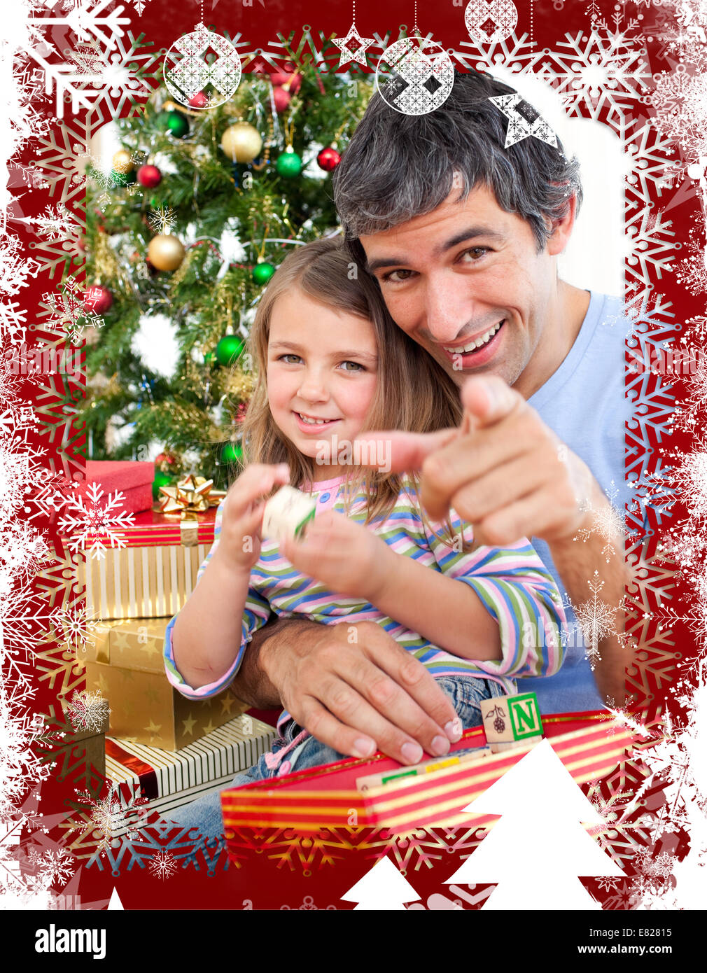 Father and little girl playing with christmas presents Stock Photo - Alamy