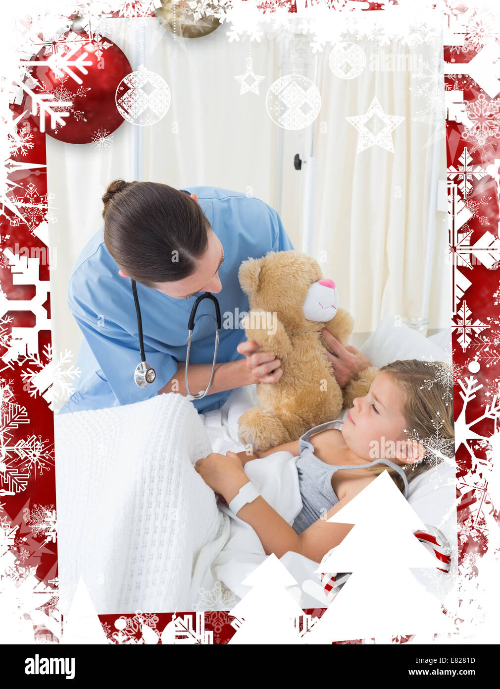 Female doctor with teddy bear entertaining sick girl in hospital bed ...
