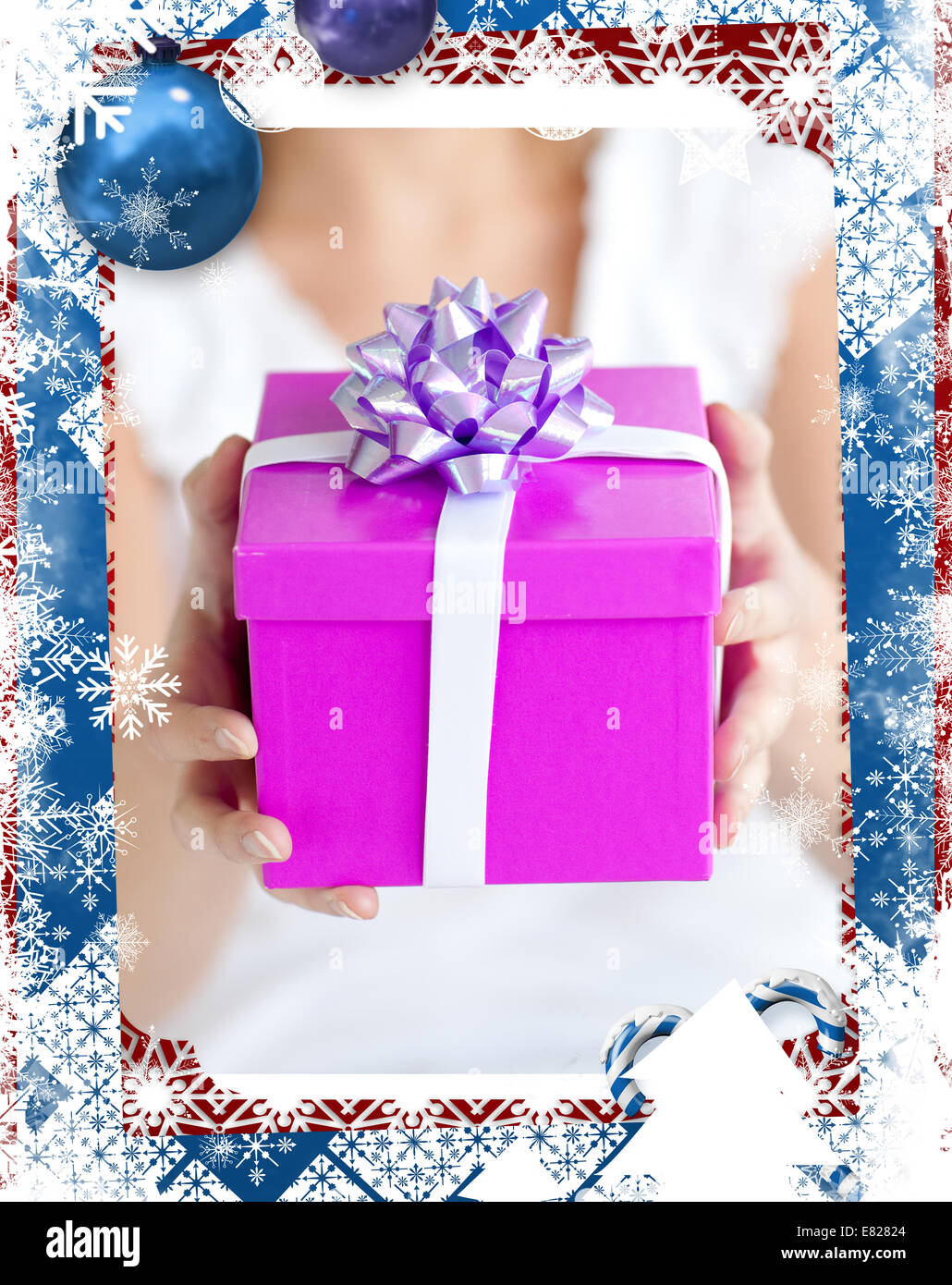 Woman holding a present sitting on the floor Stock Photo - Alamy