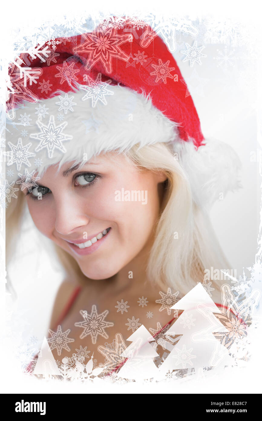 Composite image of pretty woman wearing stanta hat Stock Photo - Alamy