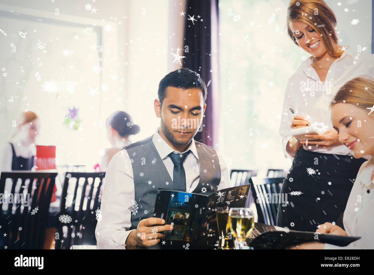 Composite image of two business people ordering dinner Stock Photo - Alamy