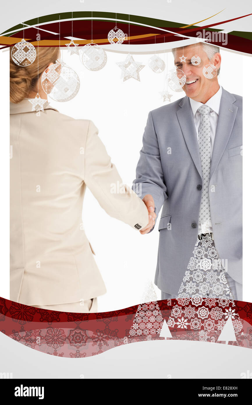 Composite image of happy business people shaking hands Stock Photo - Alamy