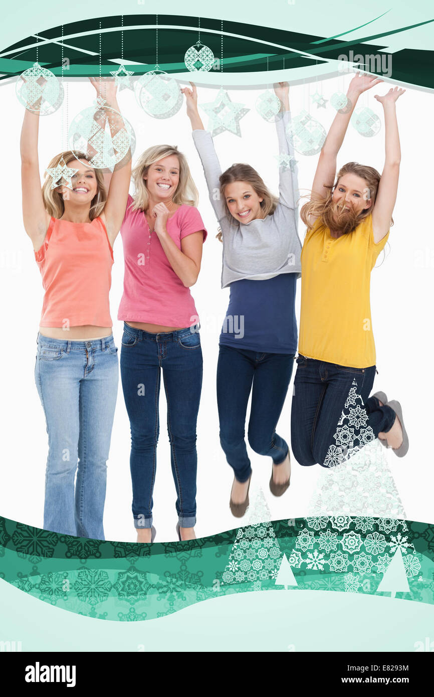 Composite image of smiling celebrating girls jumping up Stock Photo - Alamy