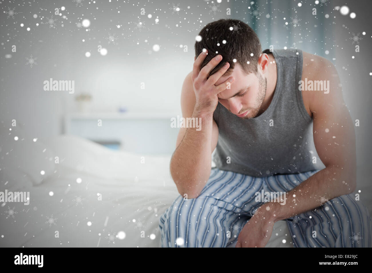 Composite image of sad man sitting on his bed Stock Photo - Alamy
