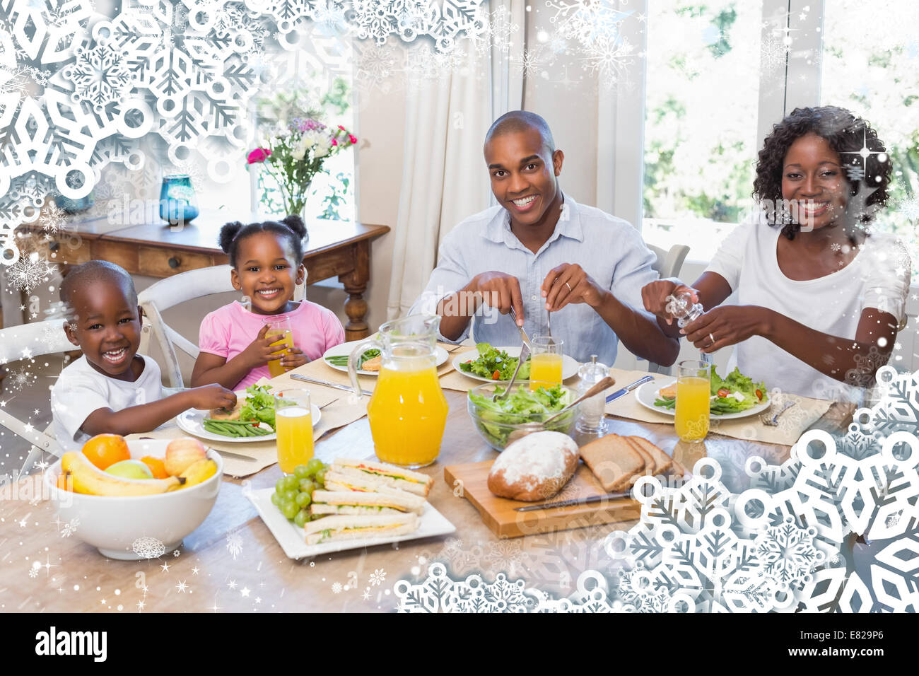 Happy family enjoying a healthy meal together Stock Photo - Alamy