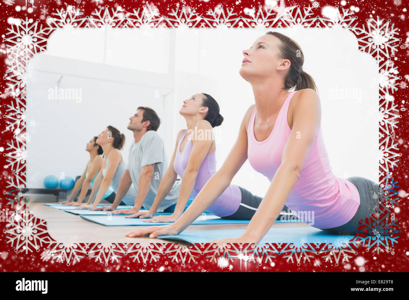 Class exercising in row at fitness studio Stock Photo - Alamy