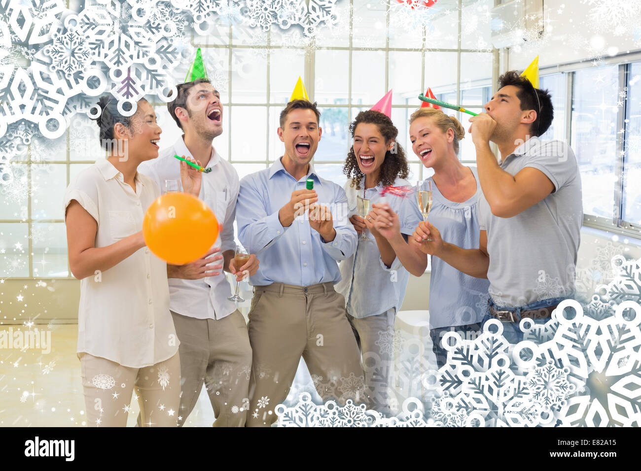 Casual business team celebrating with champagne and party poppers Stock ...