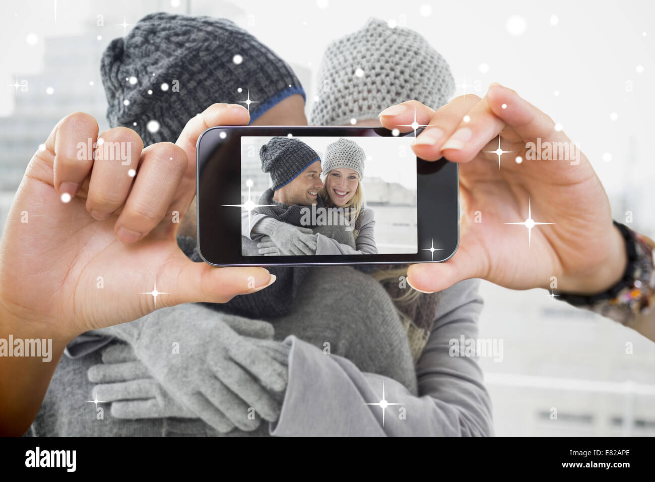 Hand holding smartphone showing photo Stock Photo - Alamy