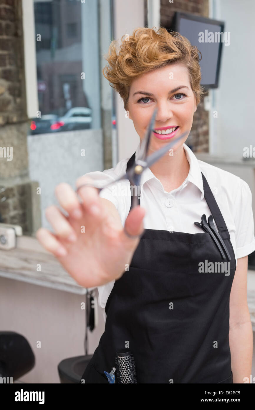 Confident hairdresser smiling at camera Stock Photo - Alamy
