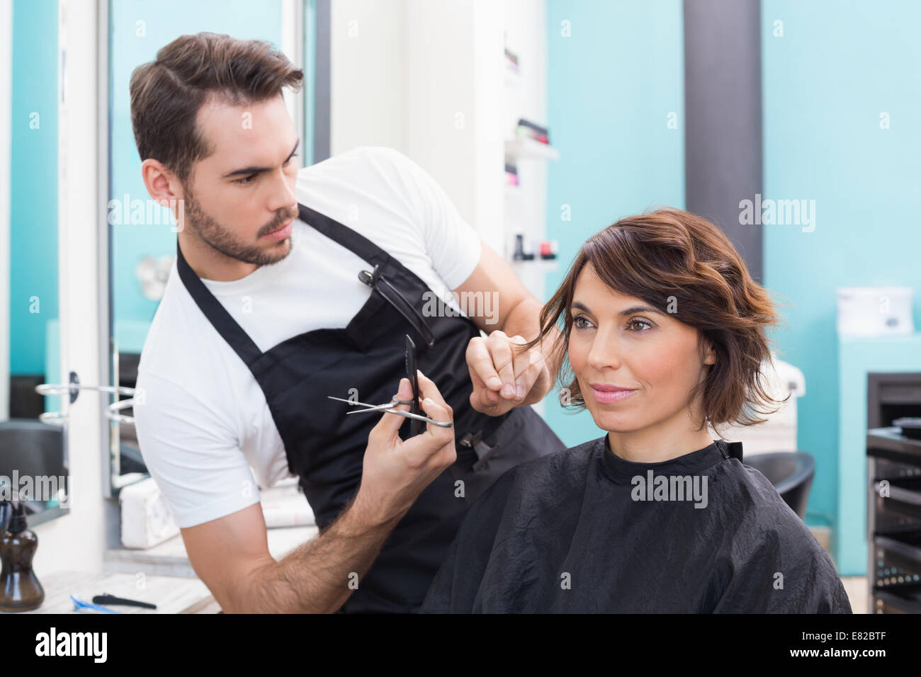 Woman getting haircut hi-res stock photography and images - Alamy