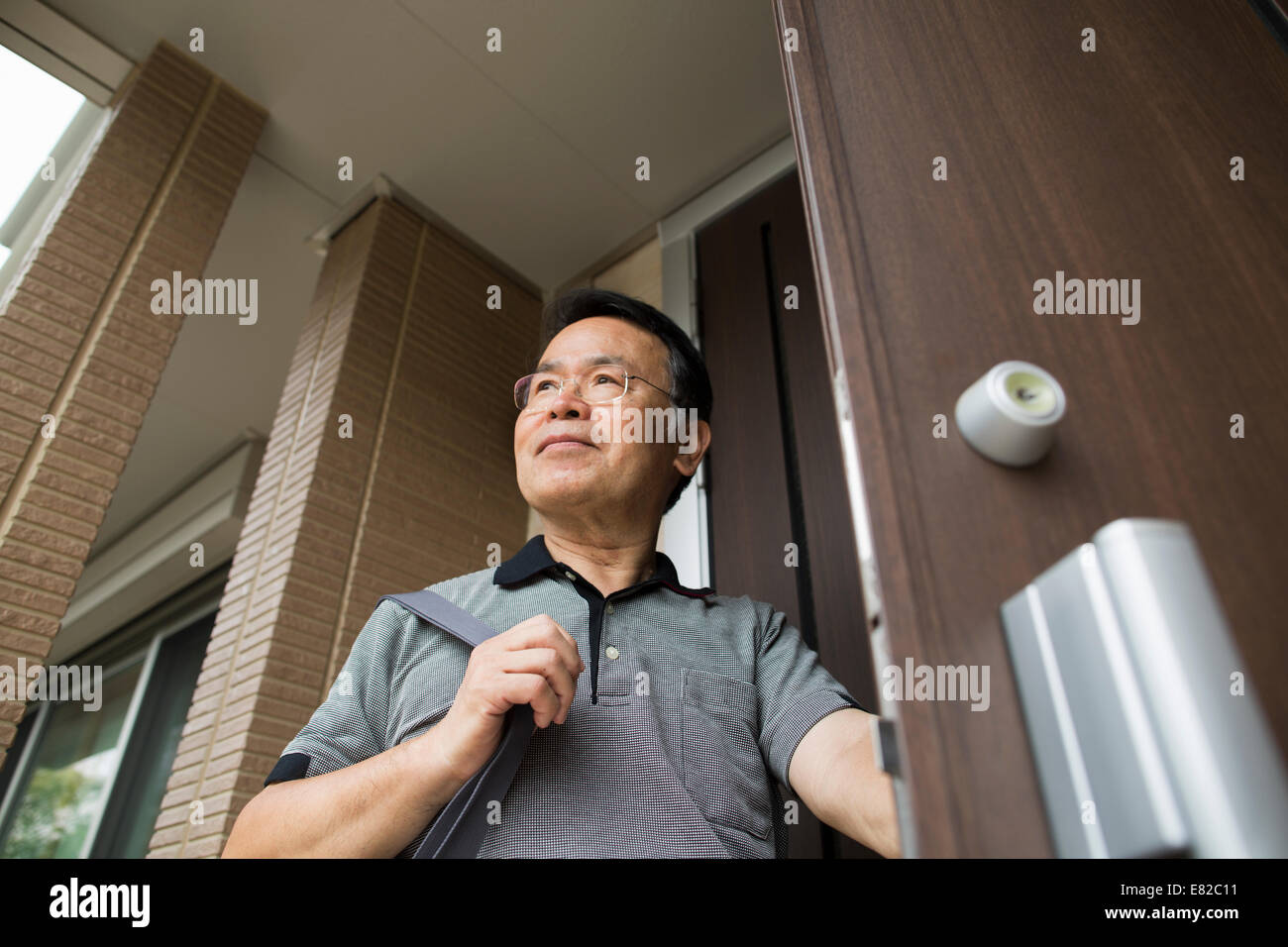 Indian man standing doorway hi-res stock photography and images - Alamy