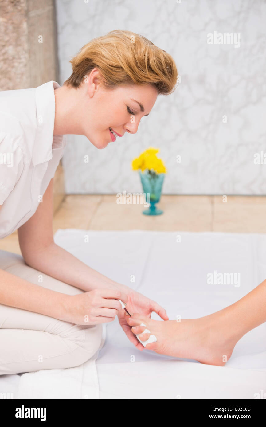 Woman getting a pedicure from beautician Stock Photo - Alamy
