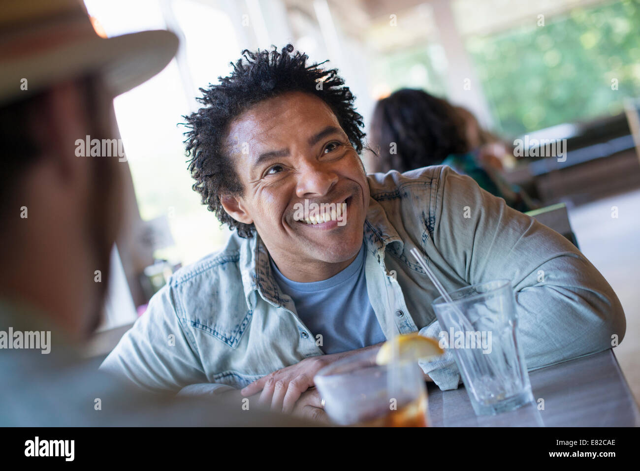 Mature man sitting restaurant hi-res stock photography and images - Alamy