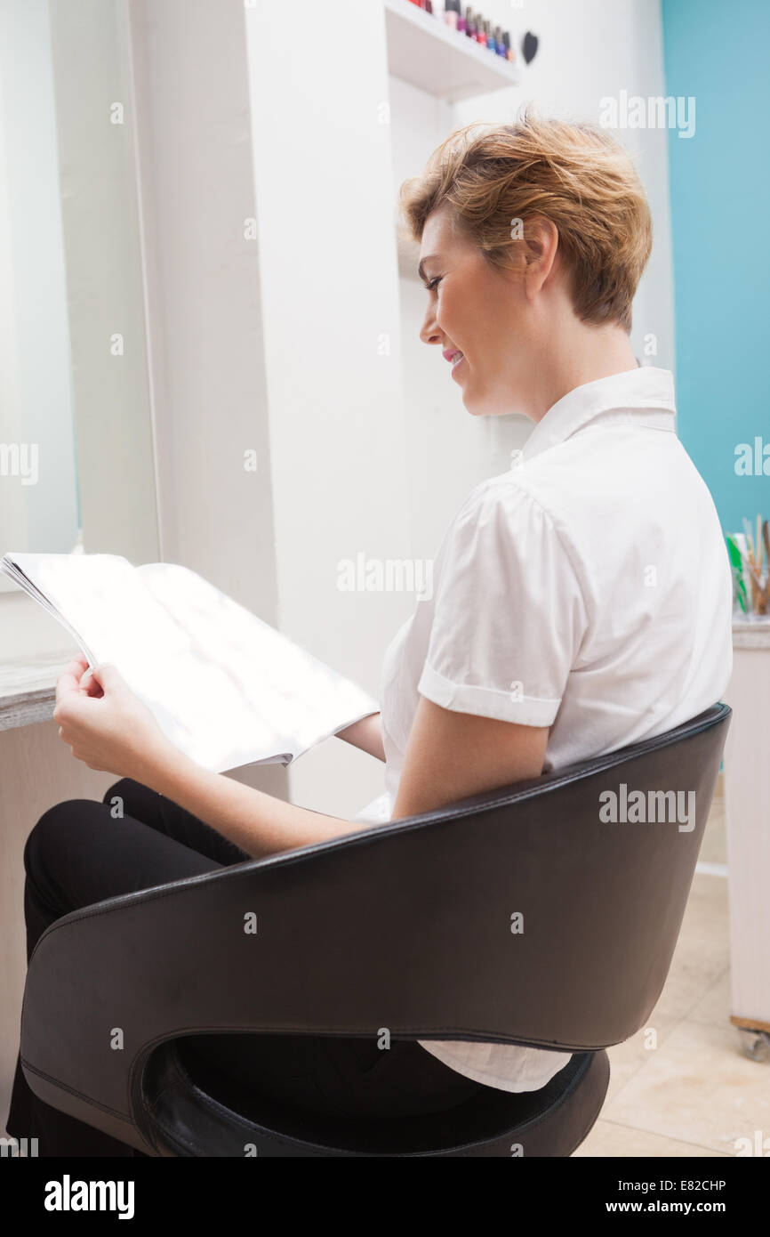 Customer sitting and reading Stock Photo - Alamy