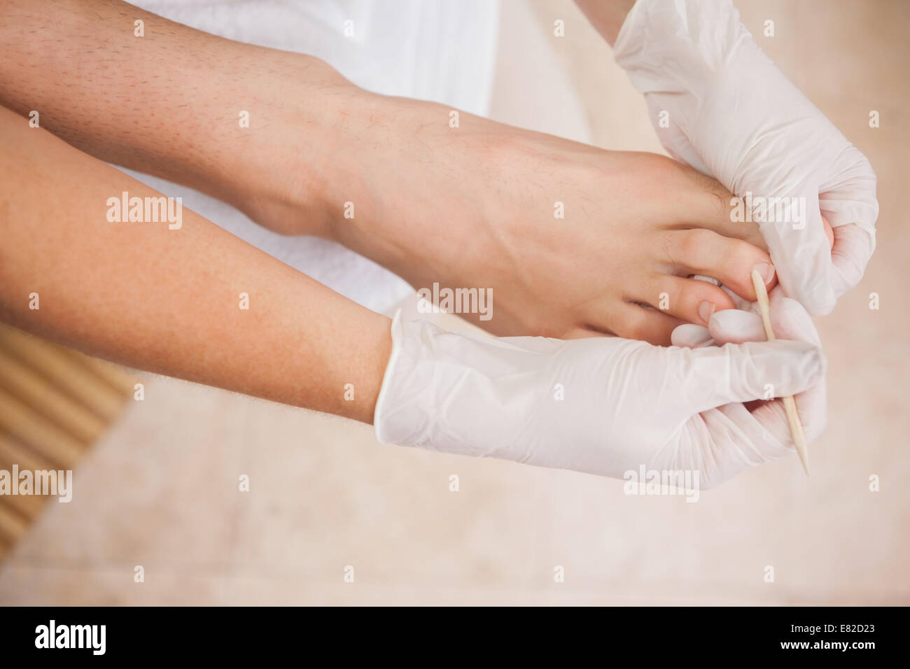 Customers toe nails getting cleaned Stock Photo - Alamy