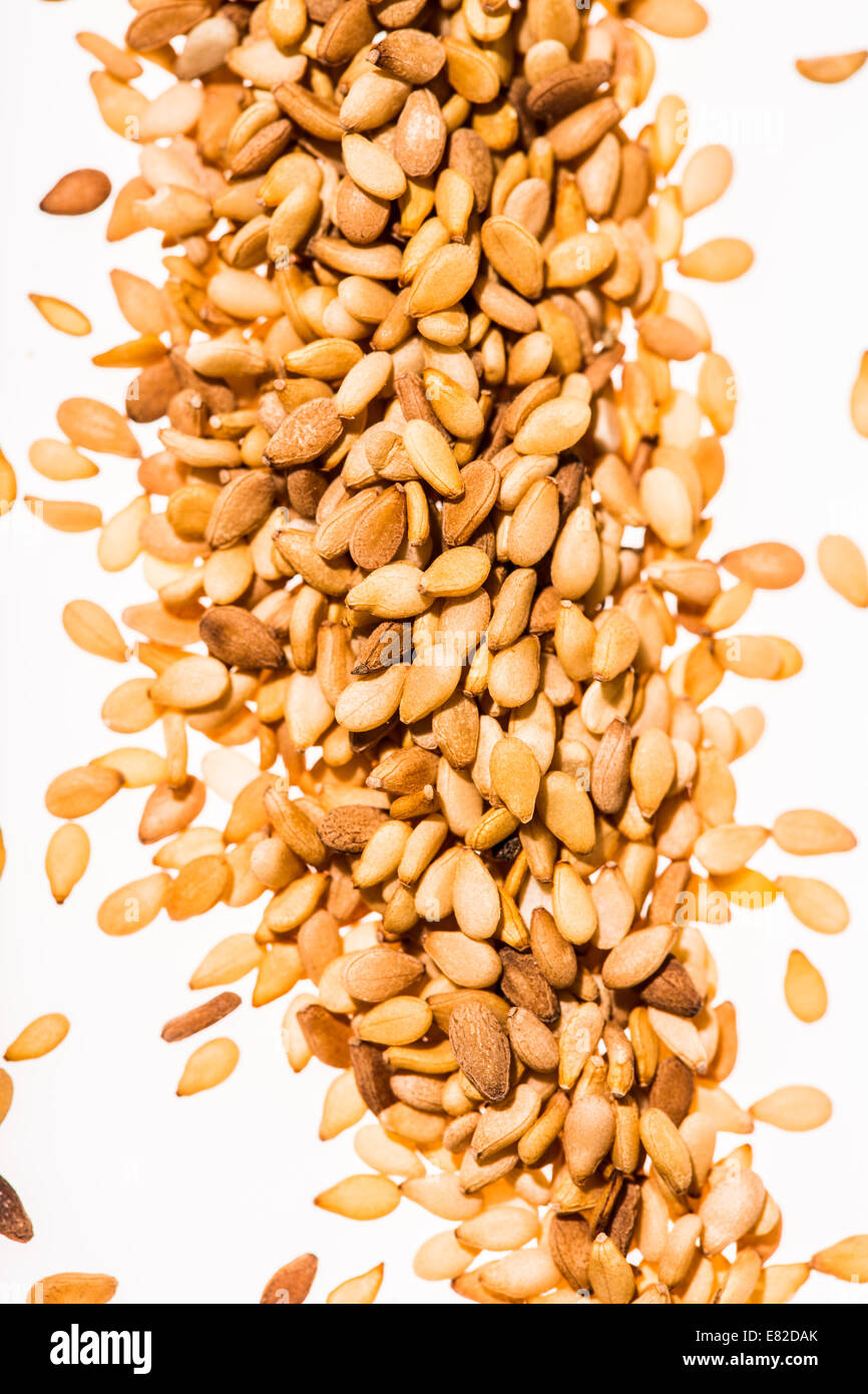 Golden sesame seeds Stock Photo - Alamy
