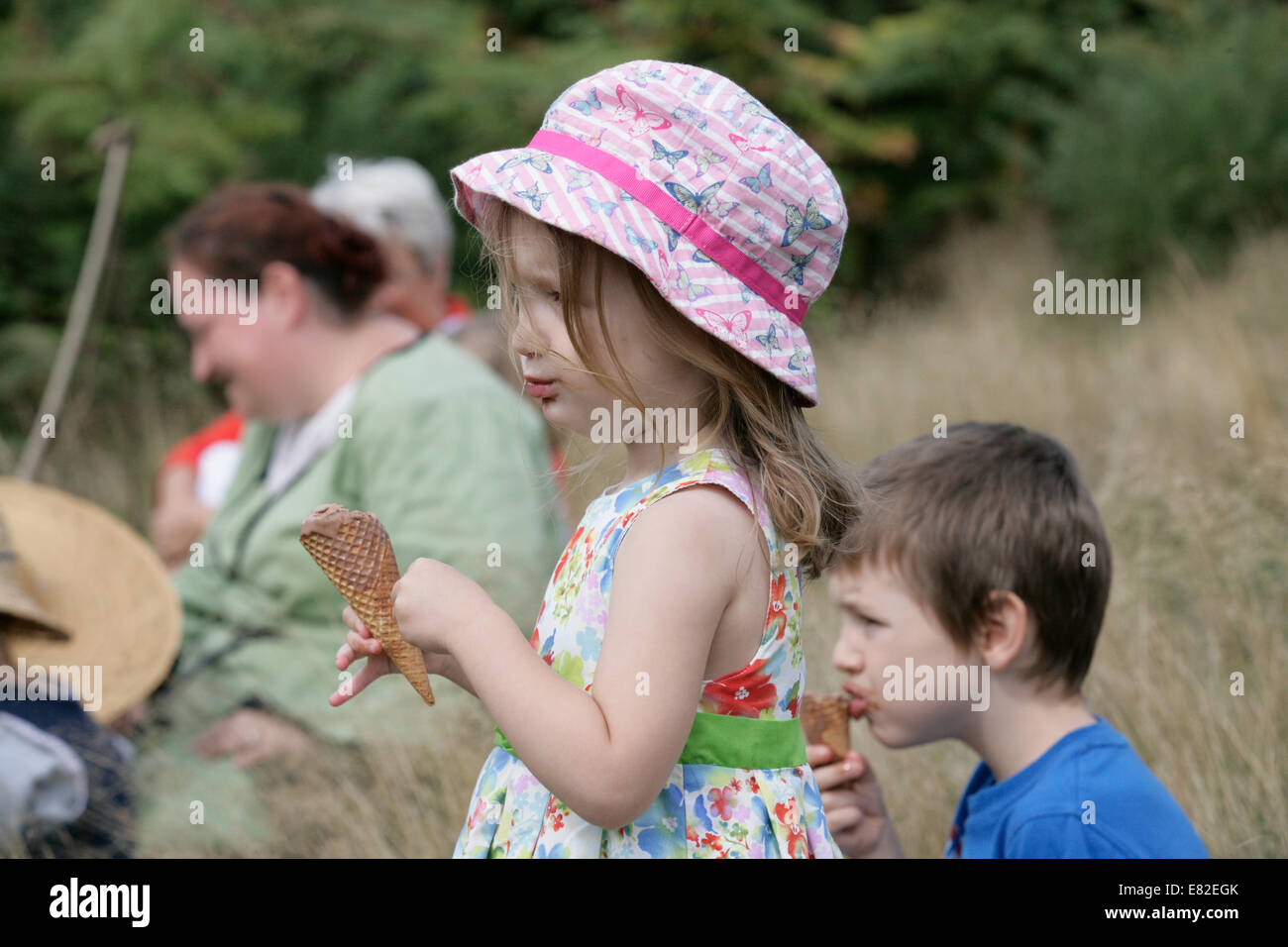 Country fair: child in hat with ice-cream Stock Photo - Alamy