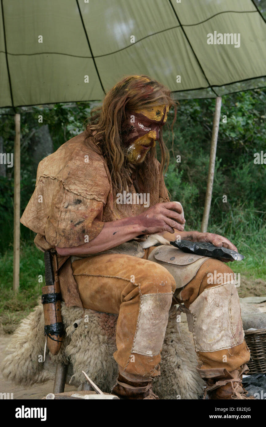 Stone Age flint napping demonstration Stock Photo - Alamy