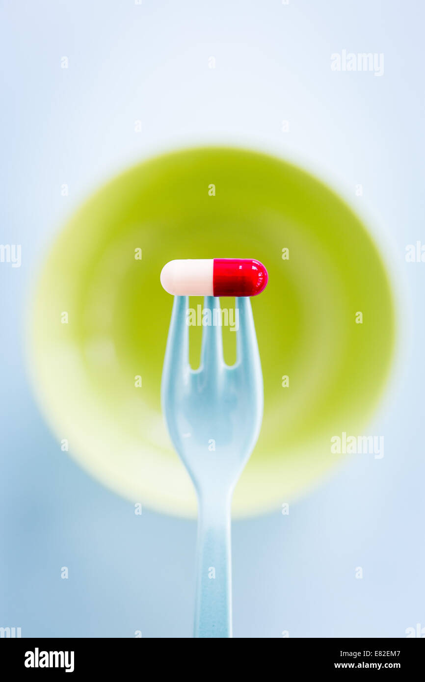 Capsule and fork Stock Photo - Alamy