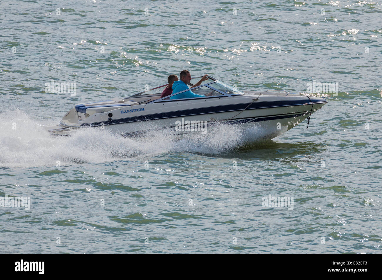 Two Men in Speedboat Passing Southend Pier Stock Photo - Alamy