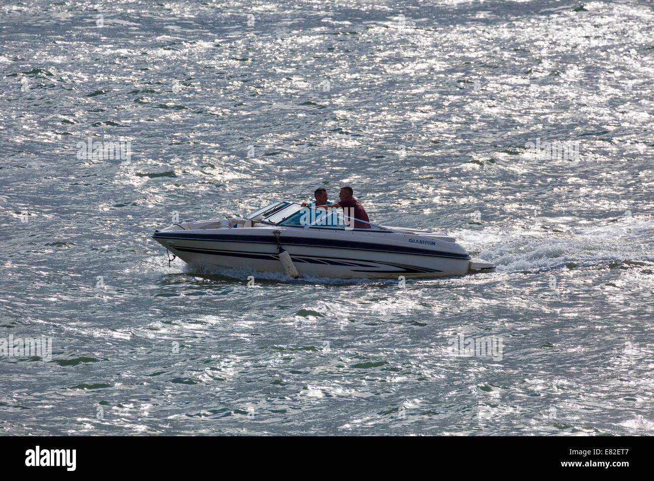 Two Men in Speedboat Passing Southend Pier Stock Photo - Alamy