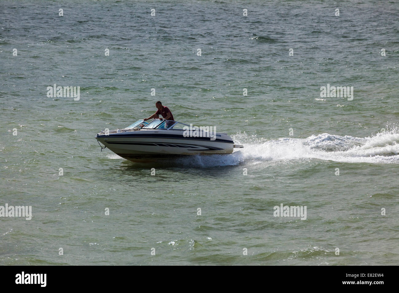 Two Men in Speedboat Passing Southend Pier Stock Photo - Alamy