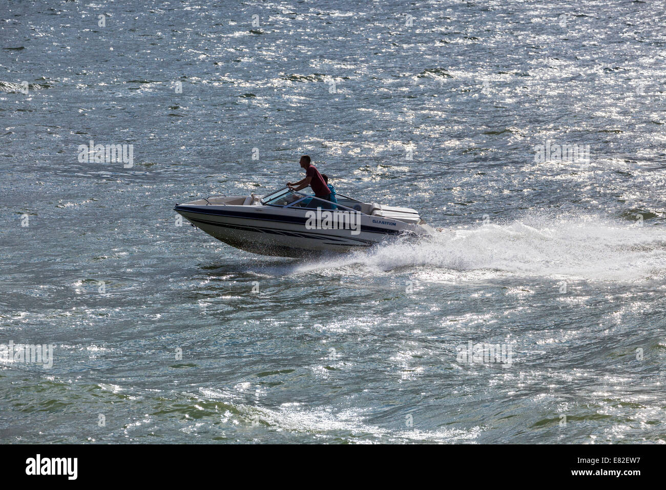 Two Men in Speedboat Passing Southend Pier Stock Photo - Alamy