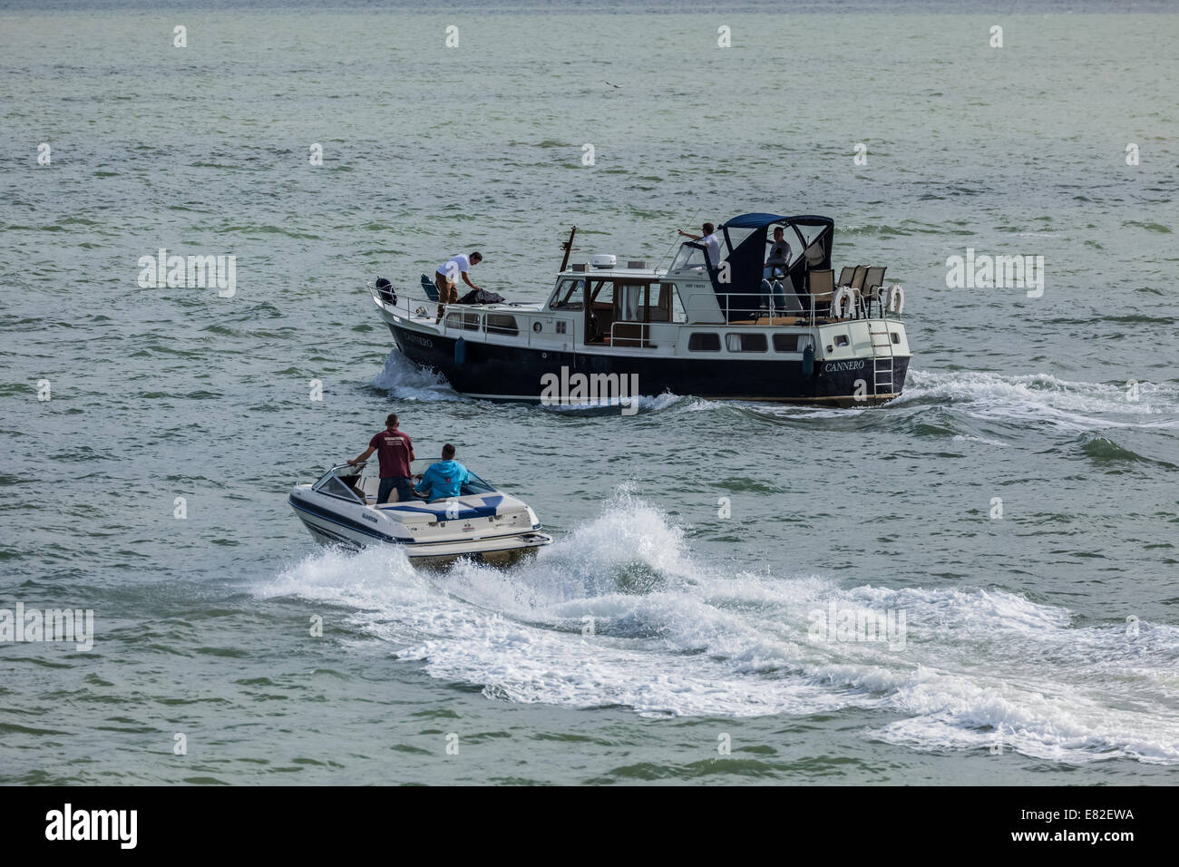 Speedboat Overtaking Slower Boat off Southend Pier Stock Photo - Alamy