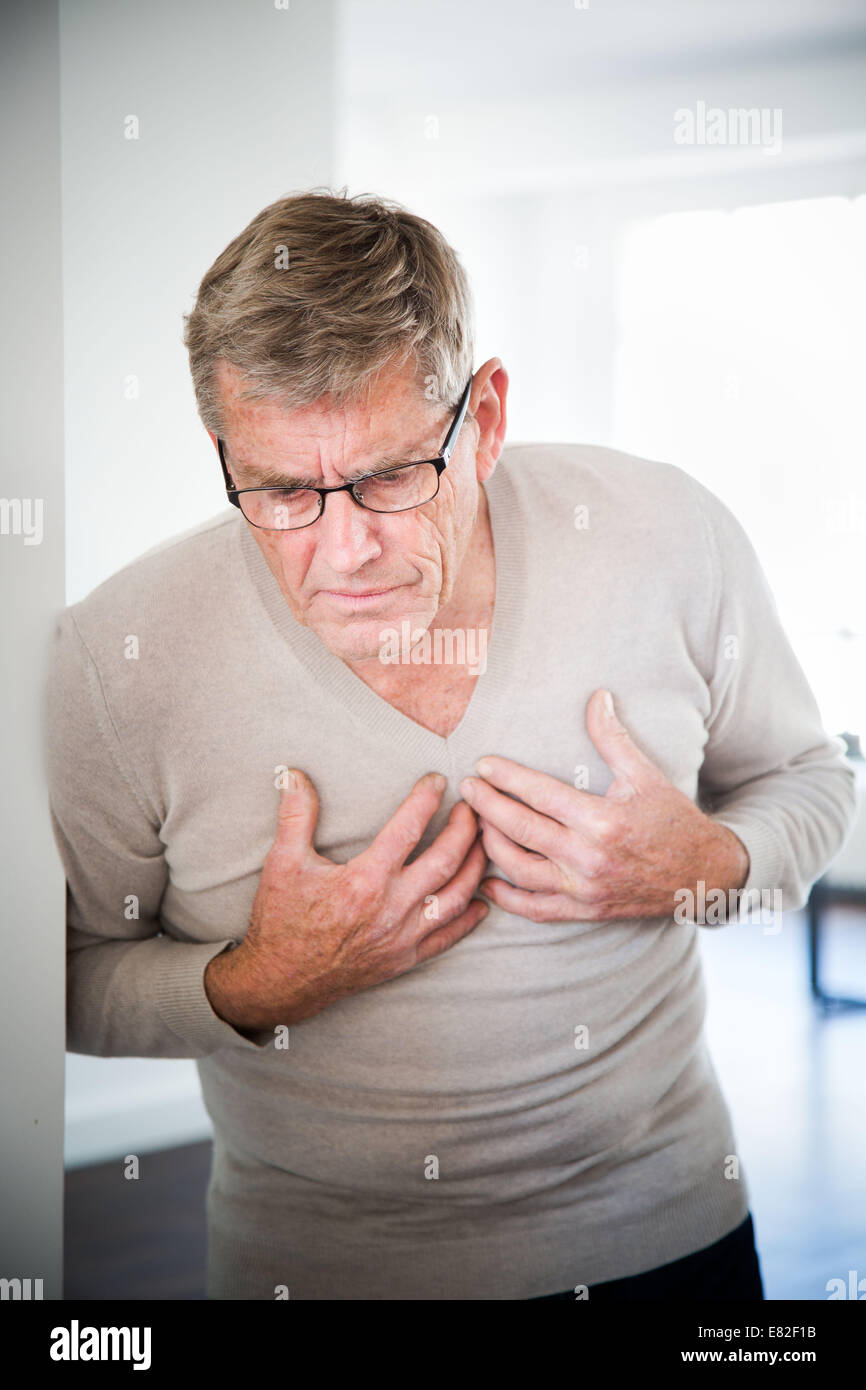 Man suffering from a mild heart attack Stock Photo - Alamy