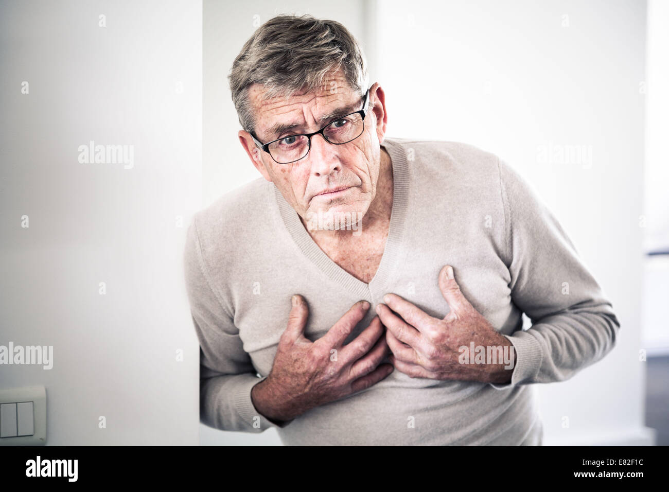 Man suffering from a mild heart attack Stock Photo - Alamy