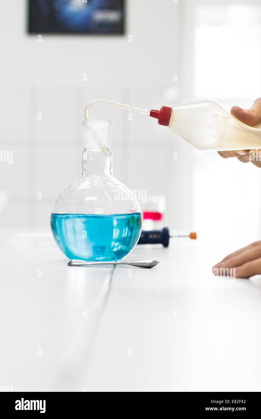 Scientist doing experiments, mixing chemicals and test samples Stock ...