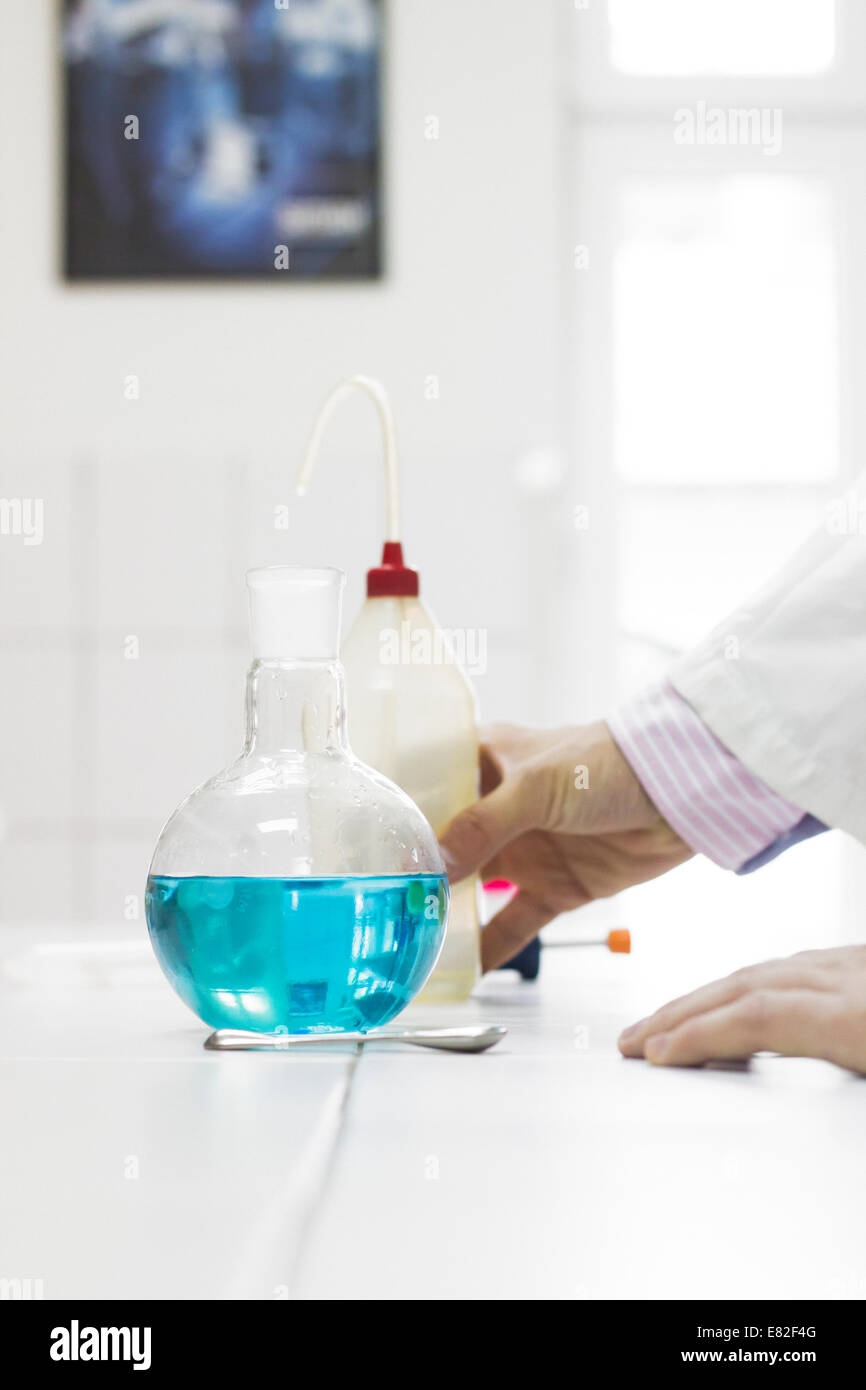 Scientist mixing chemicals hi-res stock photography and images - Alamy